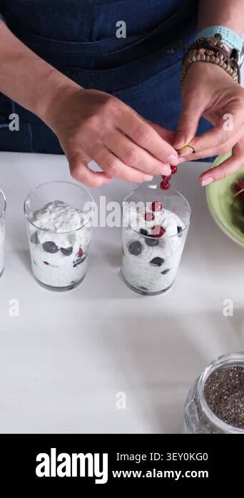 Woman Preparing Healthy Family Breakfast With Yogurt, Chia Seeds, And ...