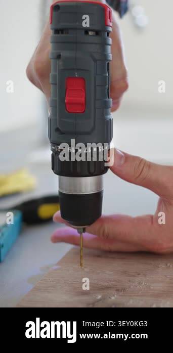 Man Marks Shelves For Bracket Installation In Kitchen Ensuring Precise ...