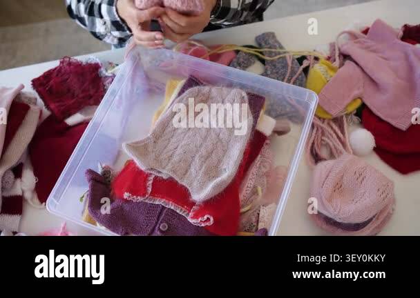 Folding Cute Clothes For A Newborn Girl Stock Video Footage - Alamy