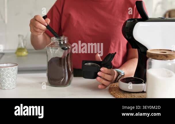 Woman Making Coffee In A Coffee Machine At Home In The Kitchen Stock ...