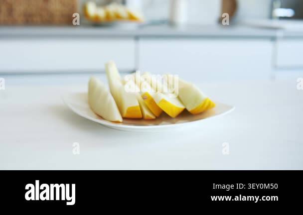 Sliced Melon On A Plate Against A Kitchen Background Stock Video ...
