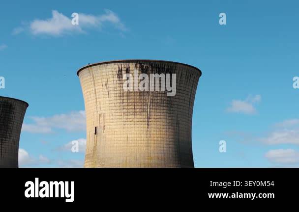 Cooling tower top against clear sky, industrial geometry and texture ...