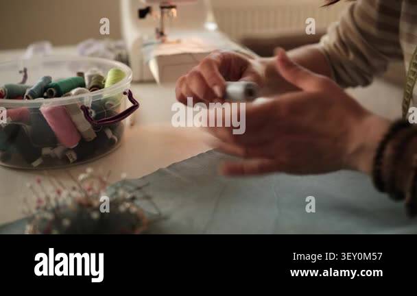 Seamstress Matches Thread To Fabric Color With Hands Up Close Stock ...