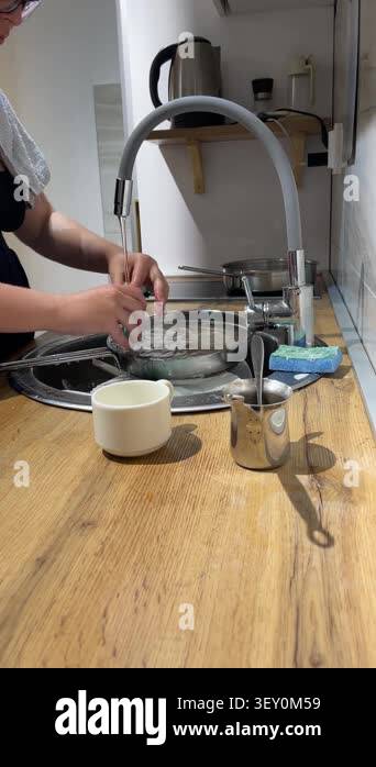 Woman hands wash dishes, housewife does household chores and cleaning ...