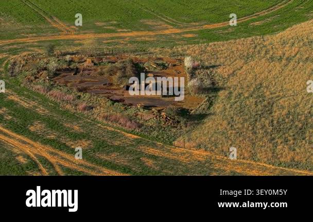 Abandoned military structure ruins concrete foundations surrounded by ...