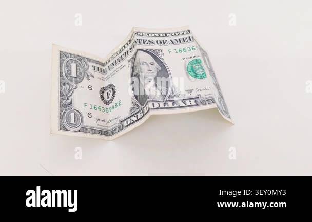 Single one US dollar banknote held in hand against white background ...