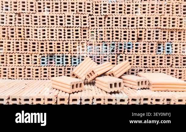Background of stacked red clay bricks in construction site Stock Video ...