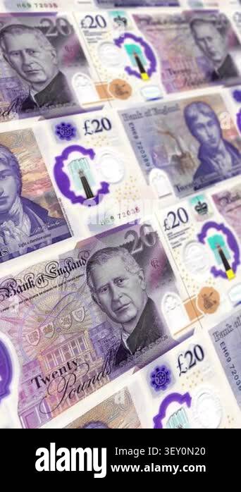Seamless looping animation of stacked British 20 pound banknotes ...