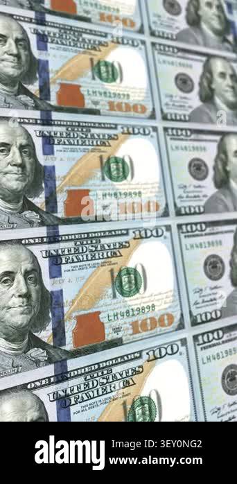 Seamless looping animation of stacked US 100 dollar banknotes, vertical ...