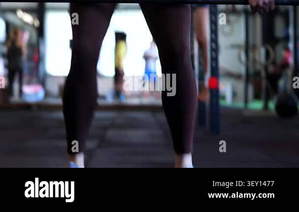 Athletic Woman with Defined Muscles Training in Modern Fitness Gym. Fit ...