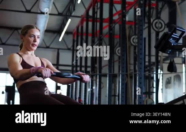Athletic Woman with Defined Muscles Training in Modern Fitness Gym. Fit ...
