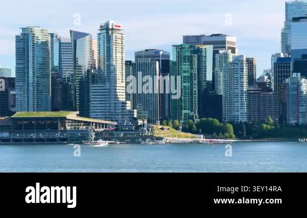 View of Vancouver, Canada with tall buildings along the waterfront. The ...