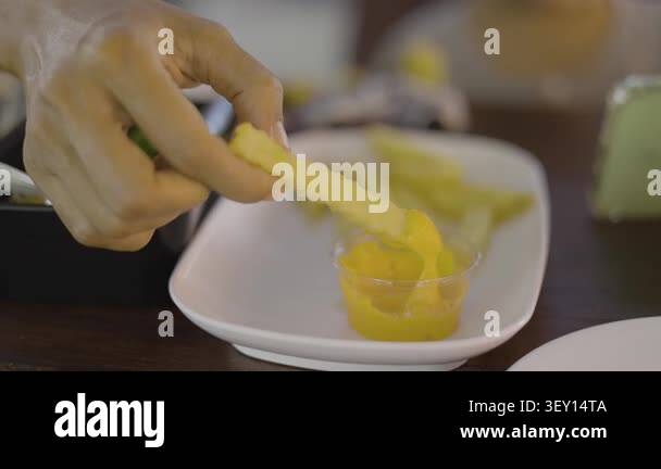 closeup of a man 's hand putting ice cream into a cup of tea Stock ...