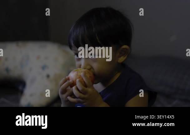asian boy eating potato chips Stock Video Footage - Alamy