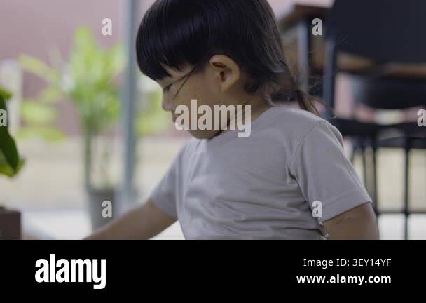 asian little boy playing with wood toy Stock Video Footage - Alamy