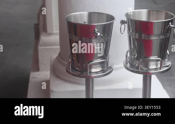 Two elegant ice buckets for champagne in a stylish restaurant, adding a ...