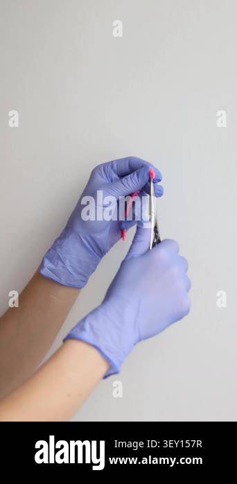 Dentist hands separating orthodontic elastic ligature rings close up ...