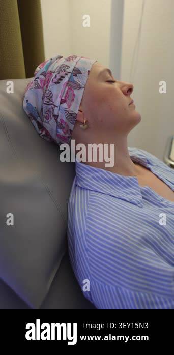 Detailed view of woman undergoing cancer treatment while resting ...