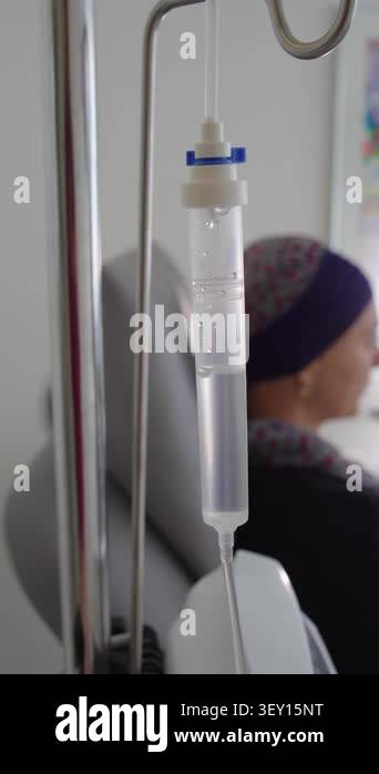 Cancer patient undergoing chemotherapy infusion in medical clinic with ...