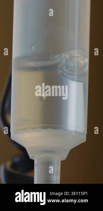Macro close up of chemotherapy drip chamber capturing individual ...