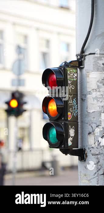 Horizontal public traffic light showing green yellow and red lamps ...