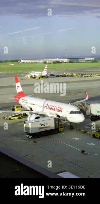 View through airport window in Austria showing airplanes on apron ...