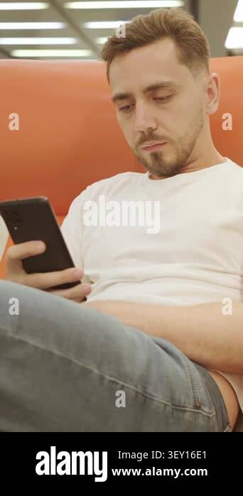 Entrepreneur or freelancer uses a smartphone while working in a cafe ...