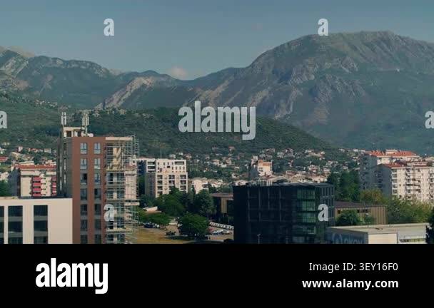 Scenic view of green mountains and Bar city in Montenegro with modern ...