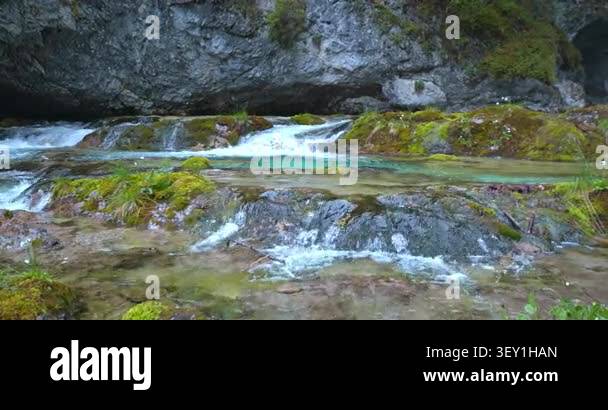 Landscape on a stream with turquoise water in the Dolomites Stock Video ...