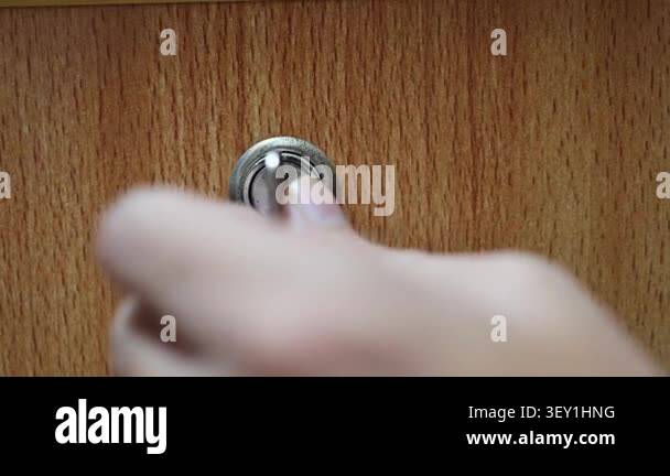 Close Up of Hand Turning Key in Cabinet Lock Stock Video Footage - Alamy