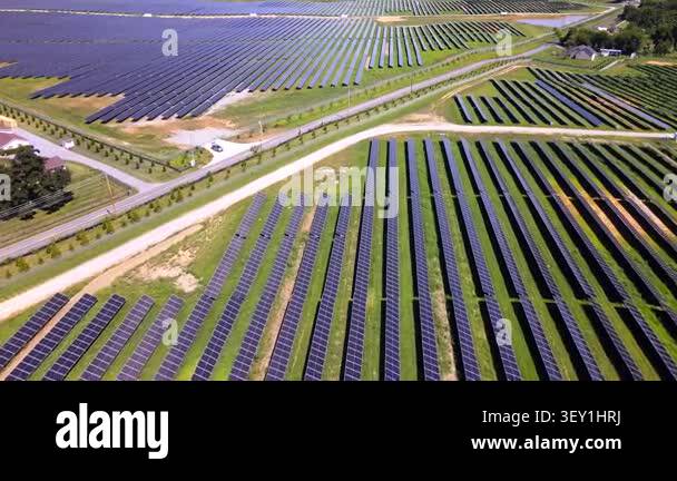 Large solar power plant with photovoltaic panels captured by drone ...