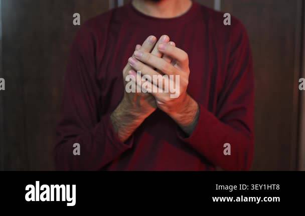 Male hands close-up. The man rubs his hands. The man clasps his hands ...