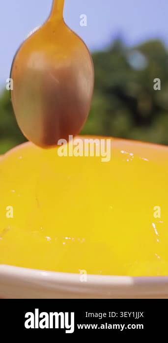 Vertical video. Fresh Citrus Dessert, Hand Holding Spoon Scooping ...