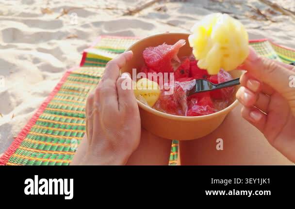 First Person View Of Hand Picking Mini Pineapple Piece From Bowl Of ...