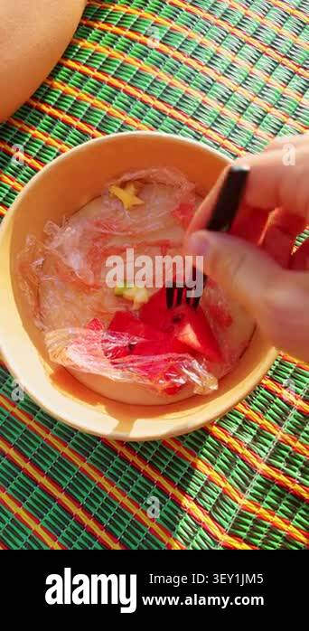 Vertical video. Top Down View Of Bowl With Watermelon Pieces And ...