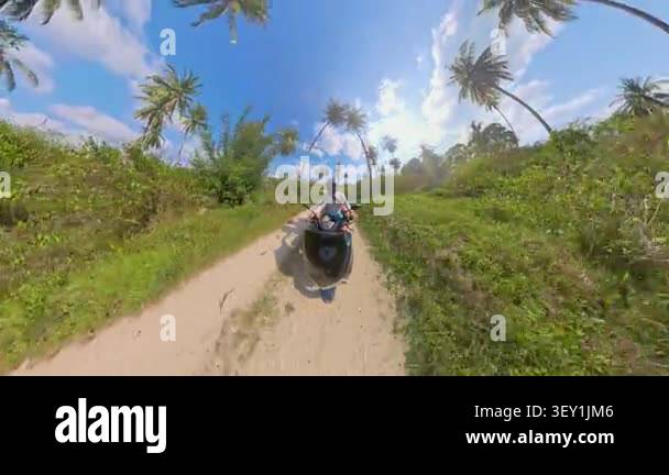 Tropical Adventure Travel, Man Riding Scooter on Sandy Path Surrounded ...
