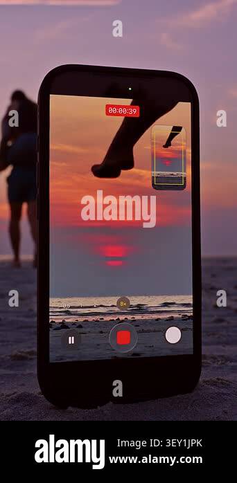 Vertical video. Smartphone Recording Man Carrying Woman in Arms Walking ...