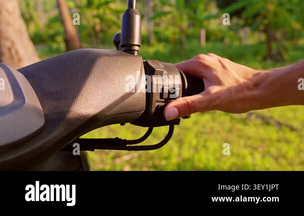 Close Up of Hand Starting Scooter Engine Using Control Switch on ...
