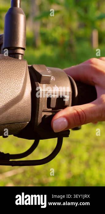Vertical video. Close Up of Hand Starting Scooter Engine Using Control ...