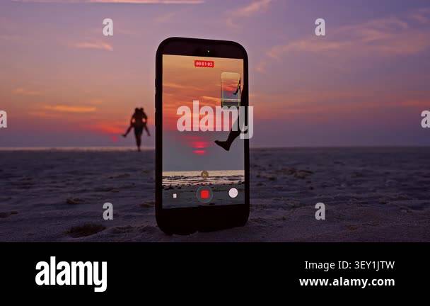 Smartphone Recording Couple Approaching Camera After Lifted Embrace ...