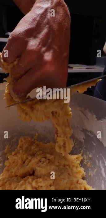 Vertical video. Hands Removing Sticky Dough From Fingers Using Knife ...