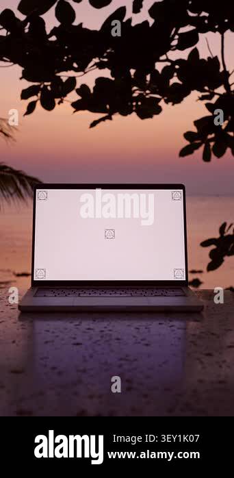 Vertical video. Laptop with White Screen Mockup on Outdoor Table at ...