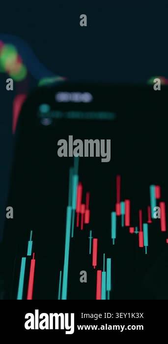 Vertical video. Trader Hand Using Smartphone with Candle Chart on ...