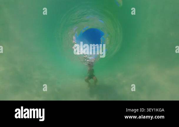 Underwater View Looking Up At Surface Opening With Person Below ...