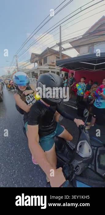 Thailand, Koh Samui 13.04.2026. Vertical video. People Splashing Ice ...