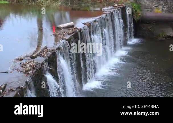 Spillway of a rock-fill dam located on a river flowing through New Hope ...