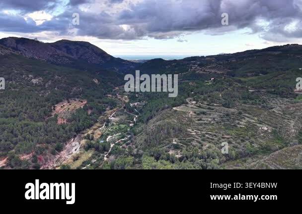 Aerial view terraced hills under storm clouds, olive groves and ...