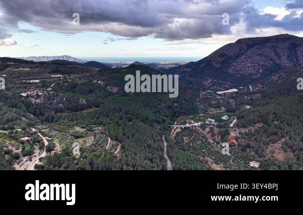 Aerial view mountain corridor to sea, deep valley framed by steep ...