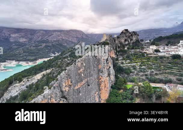 Drone view cliff turquoise reservoir panorama overlooking village ...