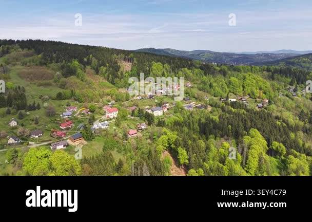 Aerial perspective of secluded hillside hamlet with scattered houses ...